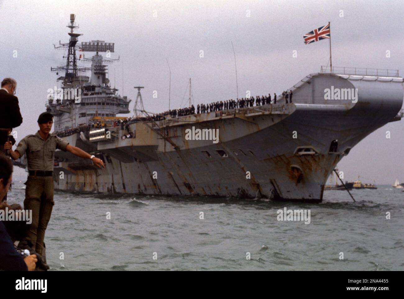 The Task Force flagship, the aircraft carrier HMS Hermes and her men ...