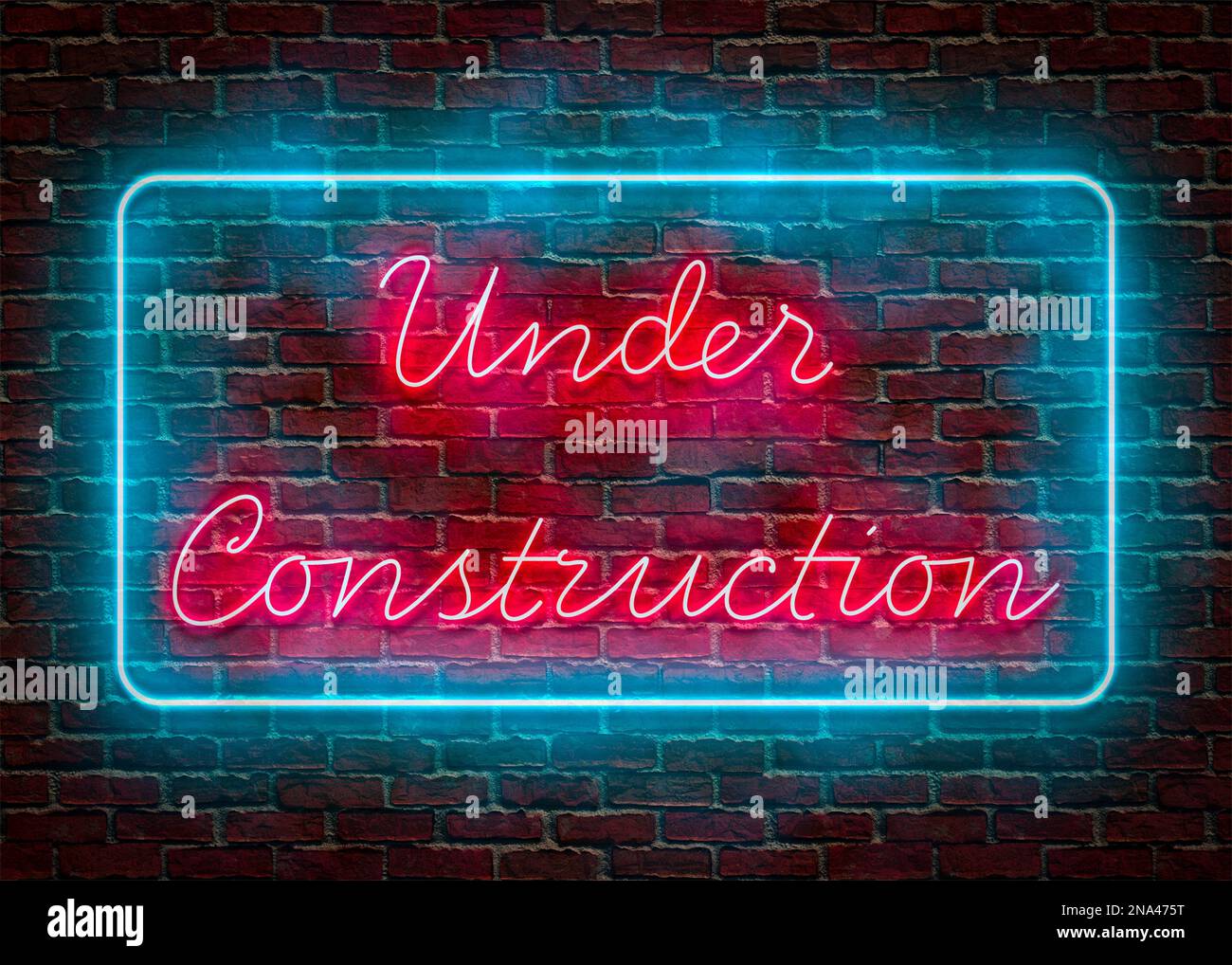 Under Construction Neon Sign on a red brick wall Stock Photo - Alamy