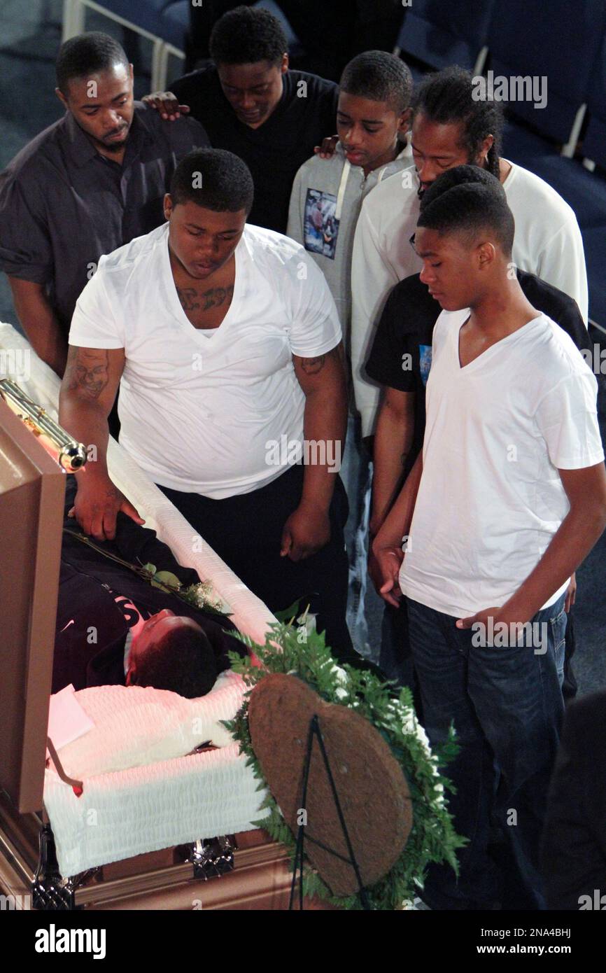 Mourners file past the caskets of Jonathan Stokely, shown, and Dexter ...