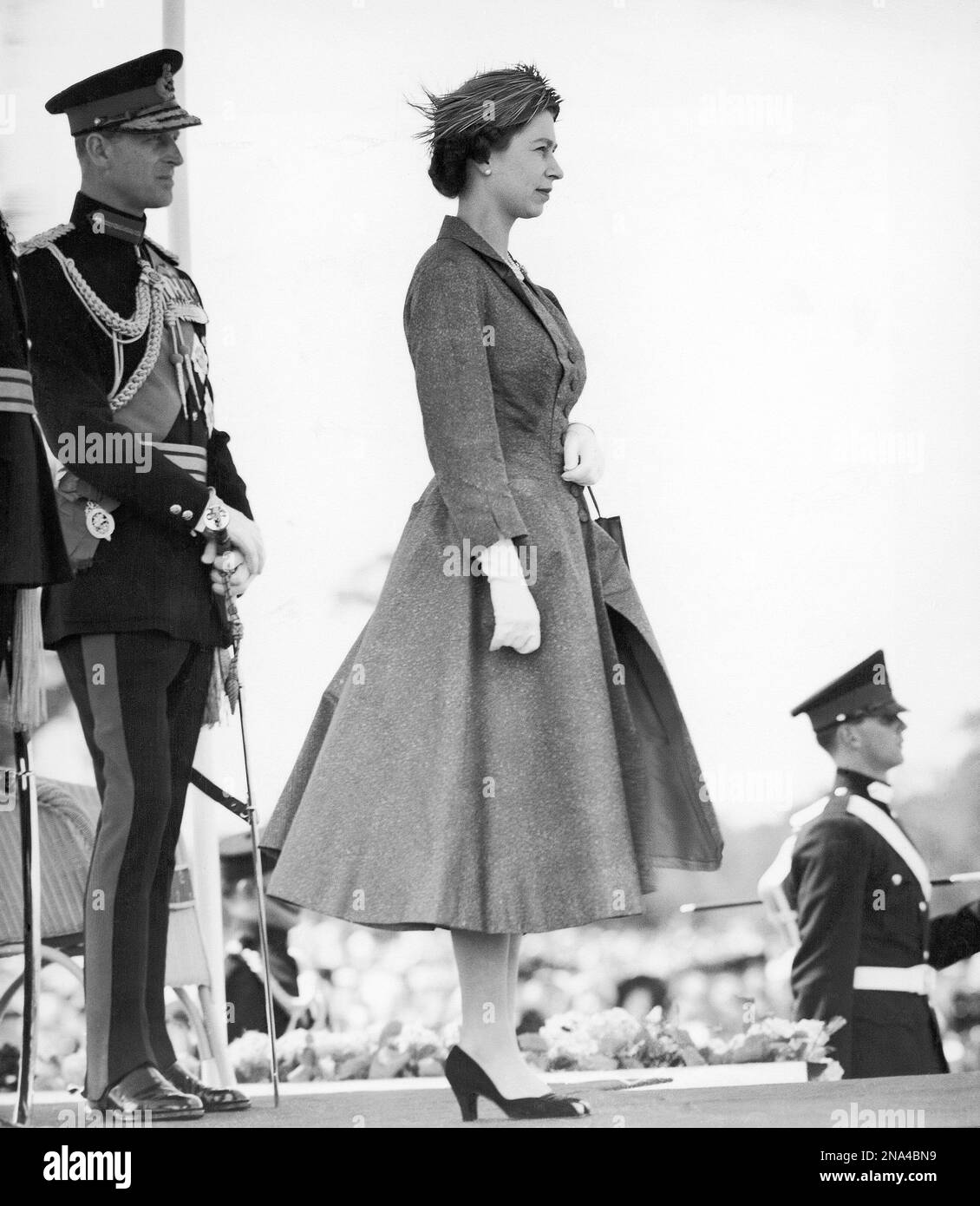 Queen Elizabeth II and Prince Philip watch the parade of officer-cadets ...