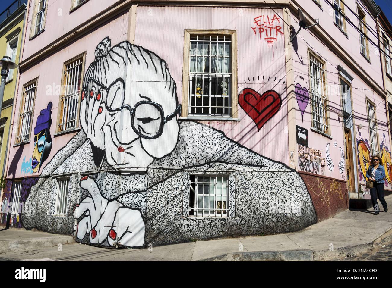 Mural painted on the side of a pink building, Cerro Concepcion ...