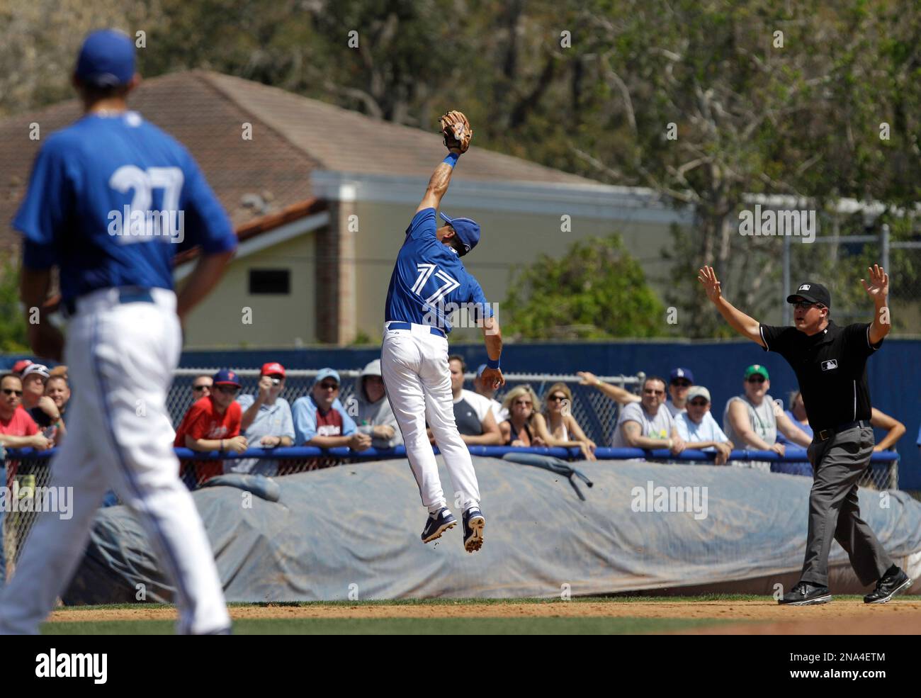 Toronto Blue Jays pitcher Brett Cecil (27) watches as third base umpire ...