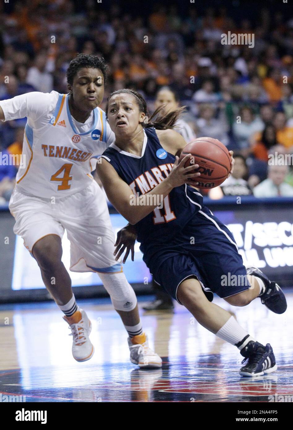 UT Martin guard Heather Butler (11) drives to the basket as Tennessee ...