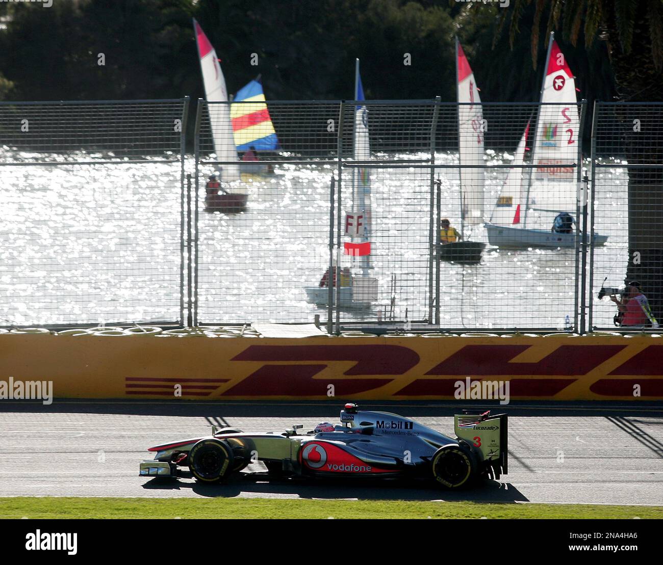 McLaren driver Jenson Button of Britain controls his car on the back ...