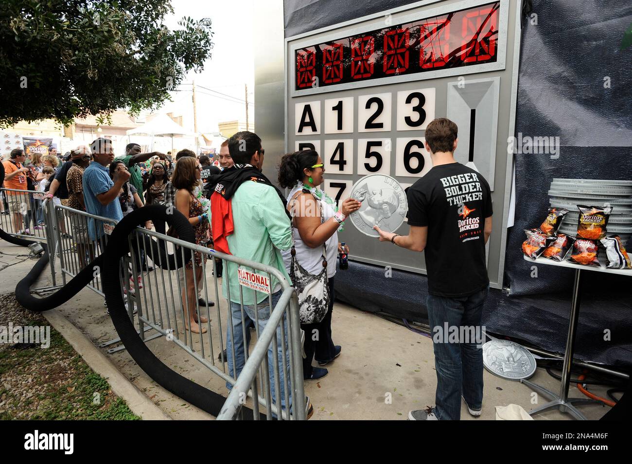 A guest puts a giant quarter inside the 56-foot-tall vending machine ...