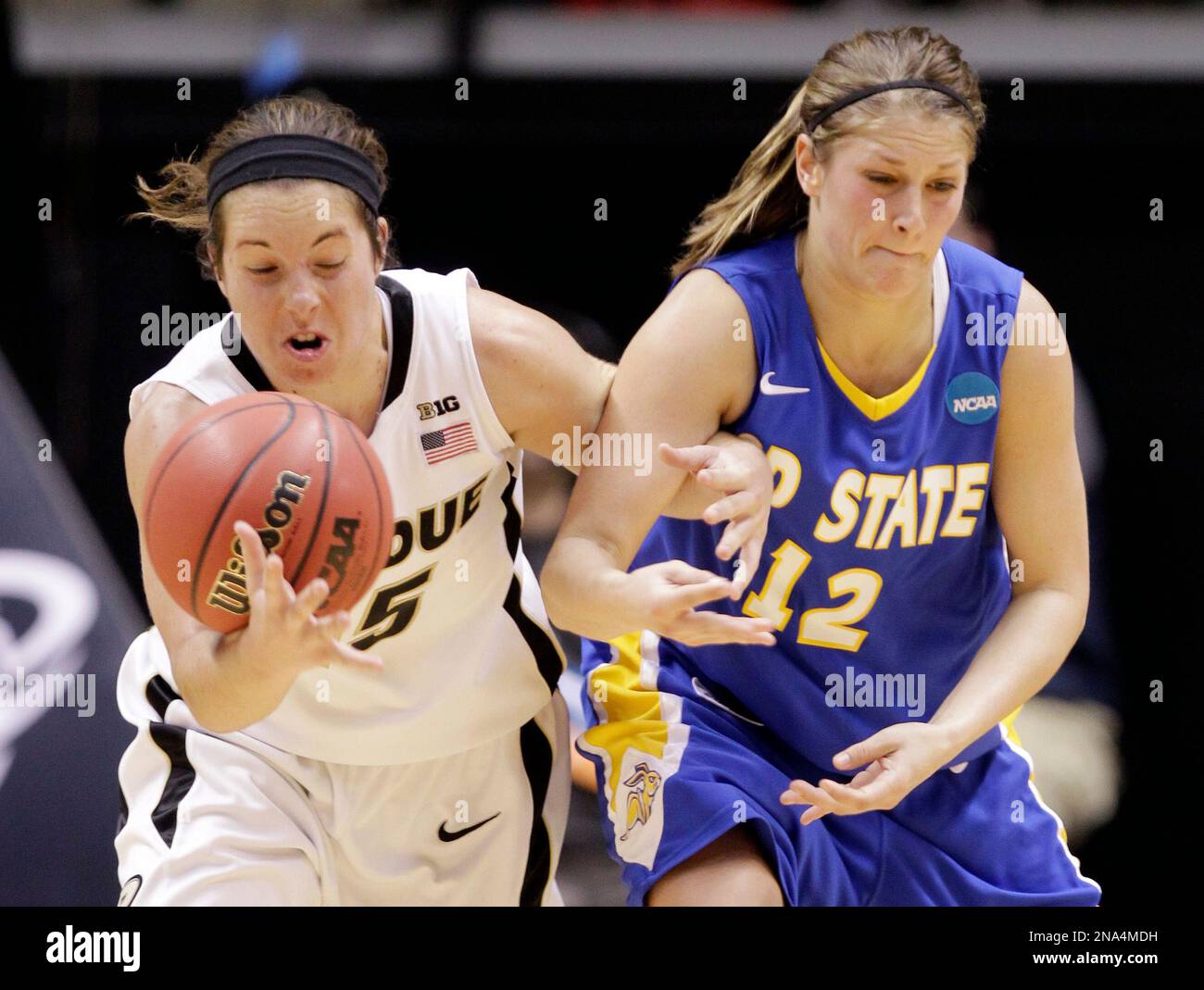 Purdue guard Courtney Moses, left, steals the ball from South Dakota ...