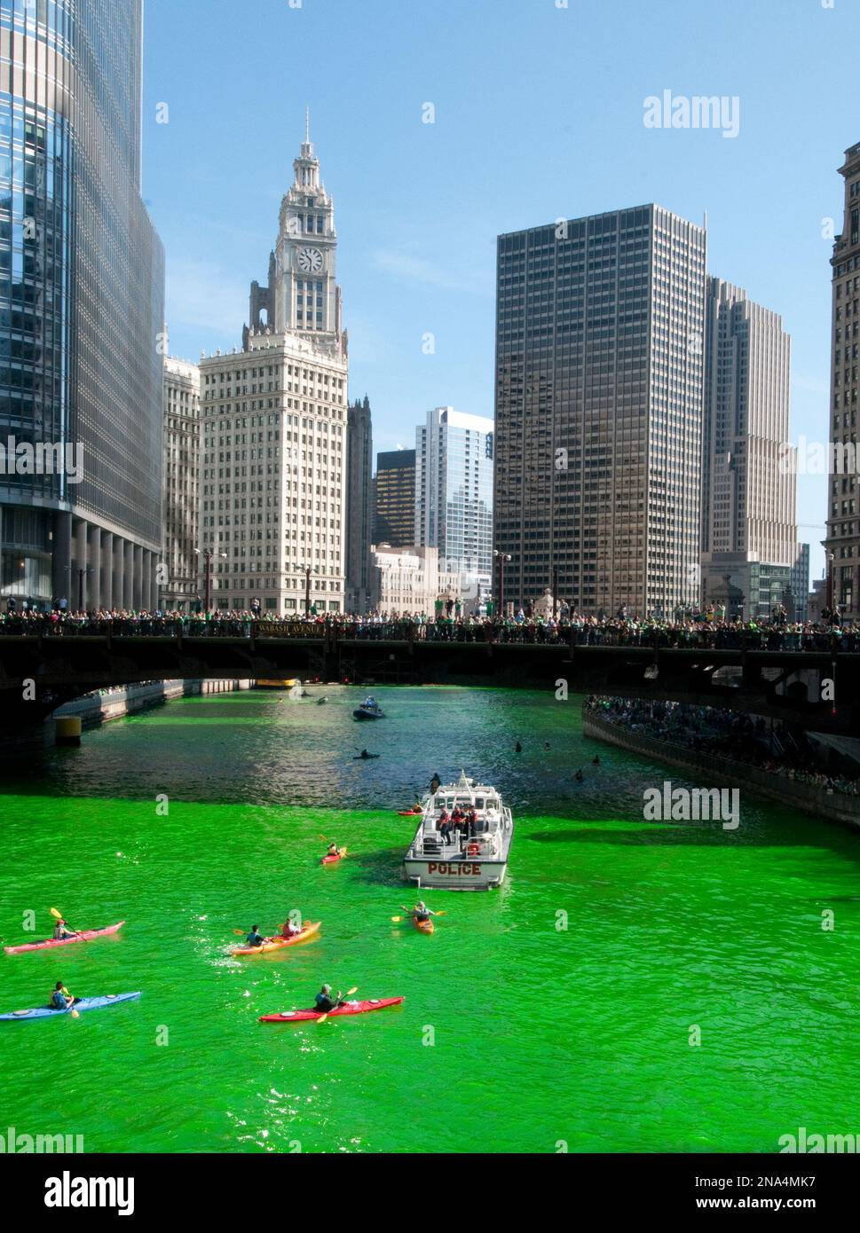Kayakers make their way down a green Chicago river Saturday morning ...