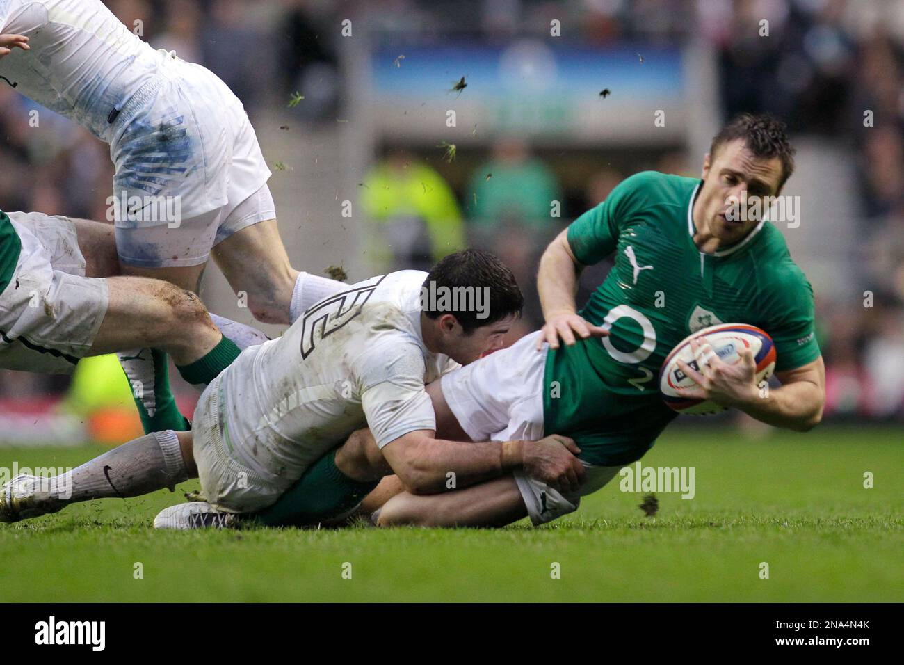 Ireland's' Tommy Bowe, right, is tackled by England's Brad Barritt ...