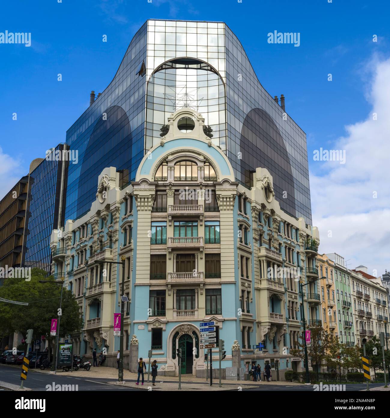Building on a street corner with facade contrasting the old and the new ...
