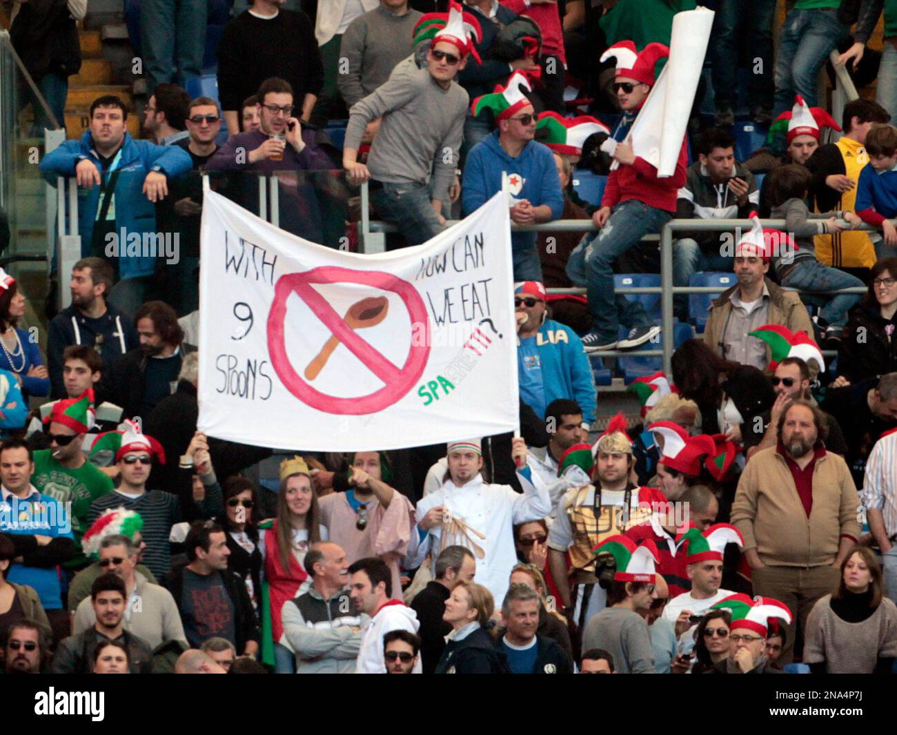 Italy's fans show a banner reading: "With nine spoons how can we eat ...