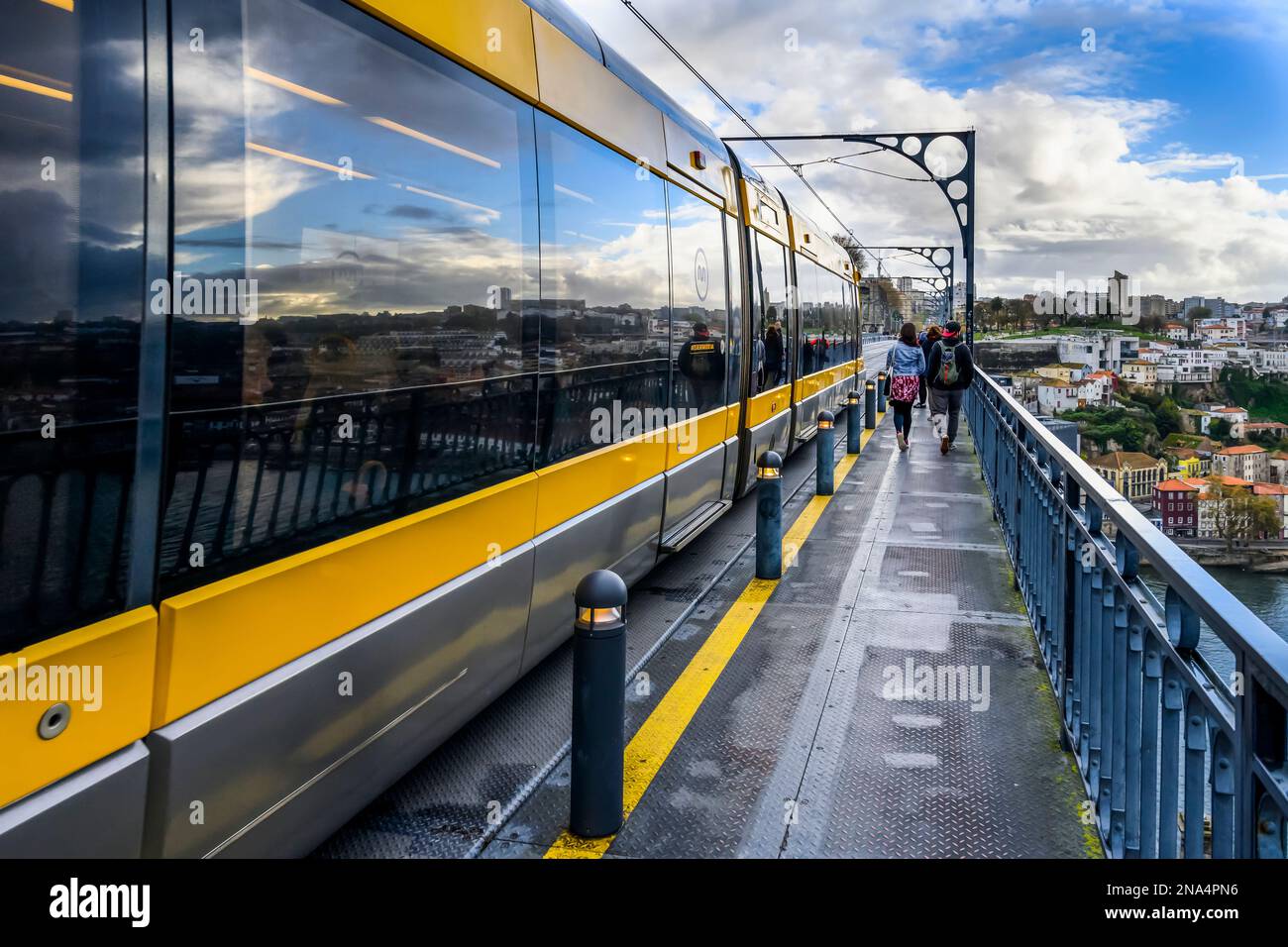 Passenger cars on a rail transit train on the Dom Luis I Bridge, the ...