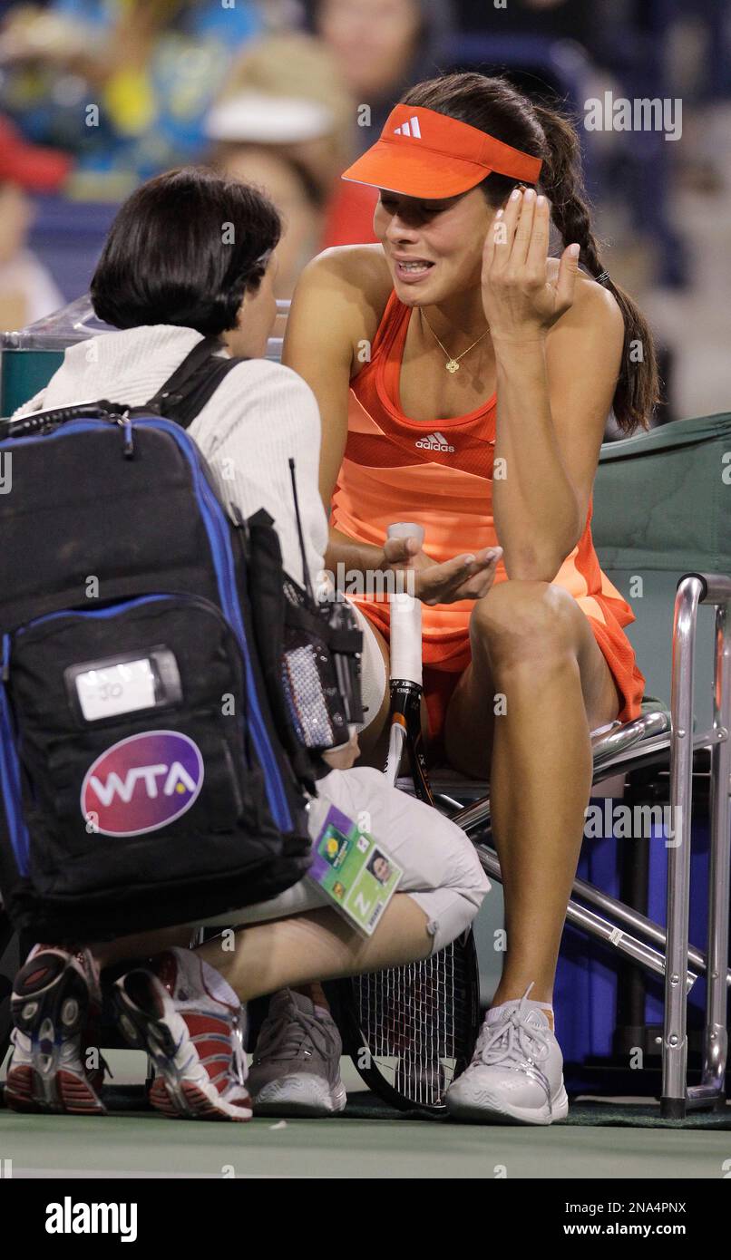 Ana Ivanovic, of Serbia, talks to a trainer during a women's semifinal ...