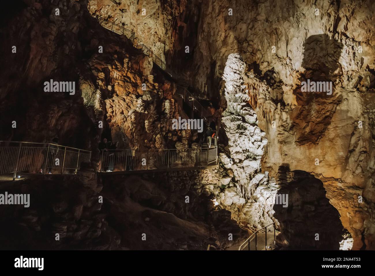 Tourists views stalagmites in an underground cave; Italy Stock Photo ...