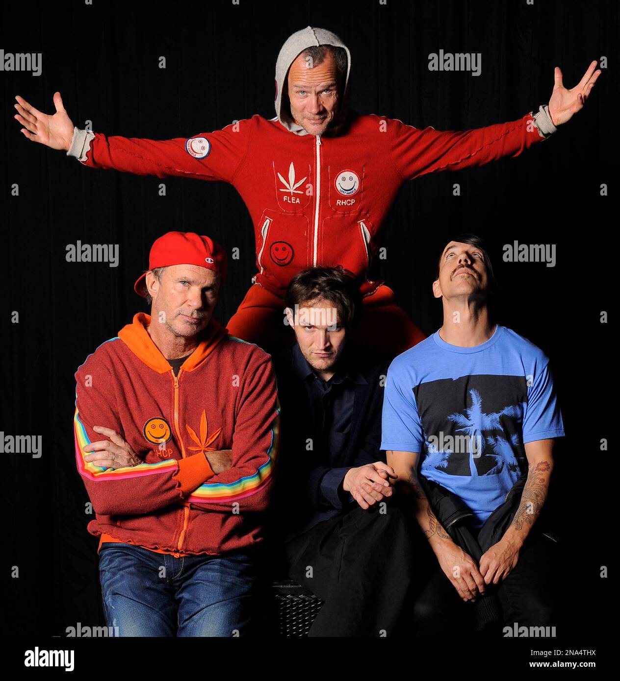 Clockwise from top, bassist Flea, singer Anthony Kiedis, guitarist Josh ...