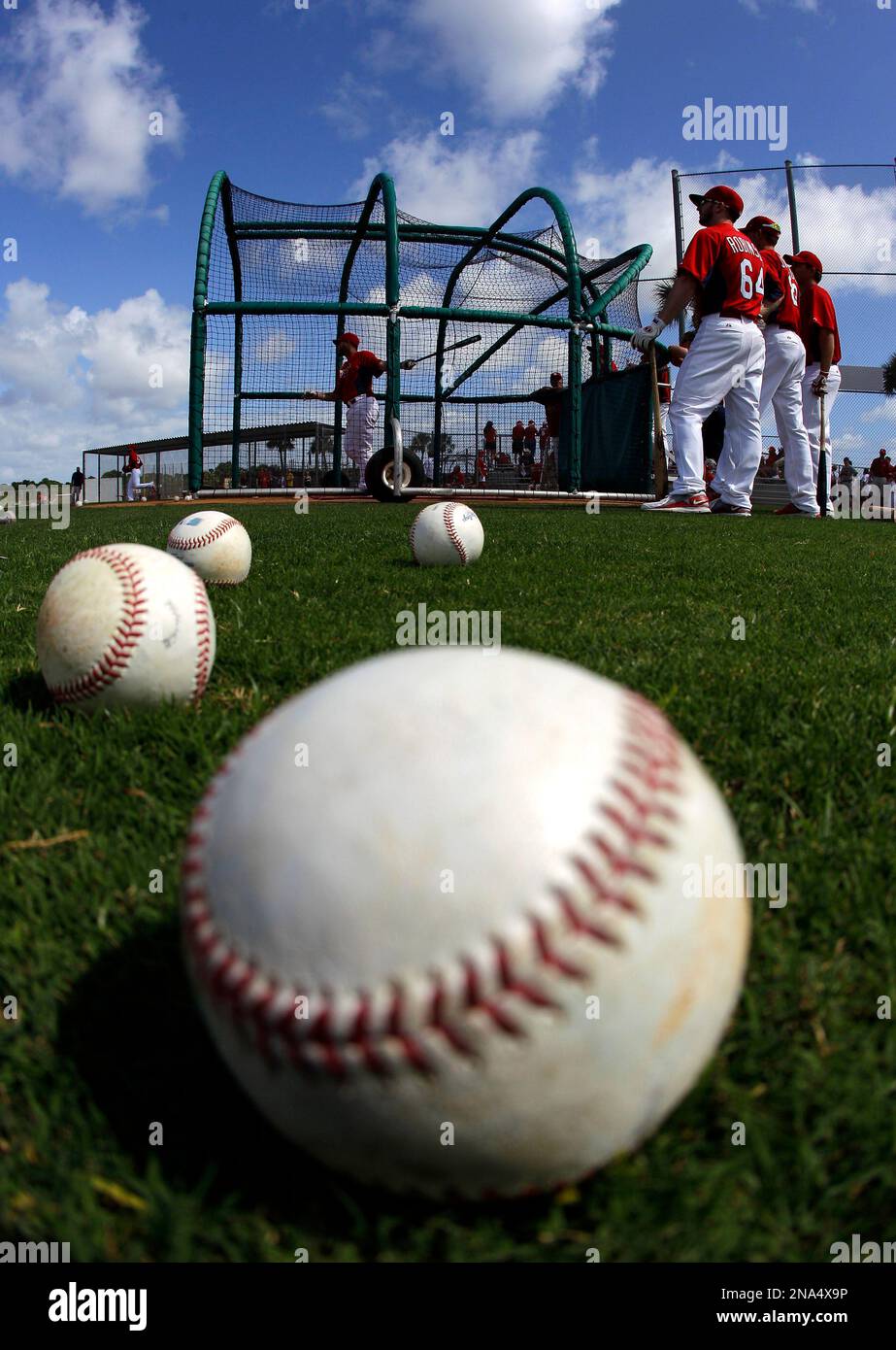 Members of the St. Louis Cardinals warm up before a spring training ...
