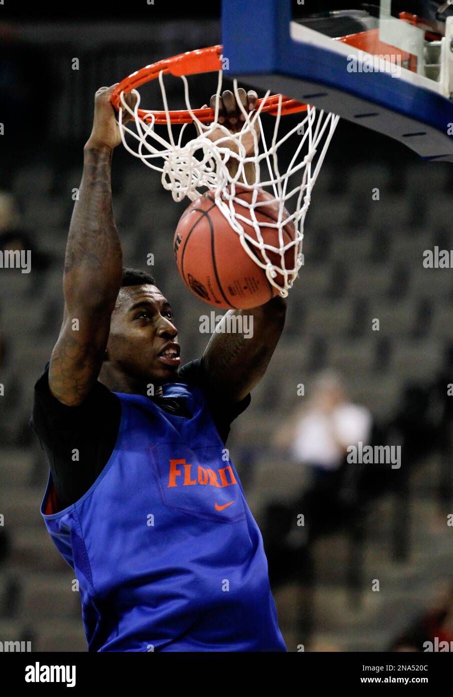 Florida's Casey Prather dunks during practice at the Century Link Arena ...