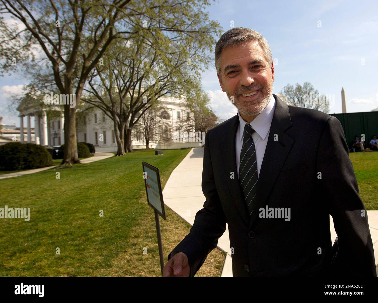 Actor George Clooney leaves the White House in Washington, Thursday ...