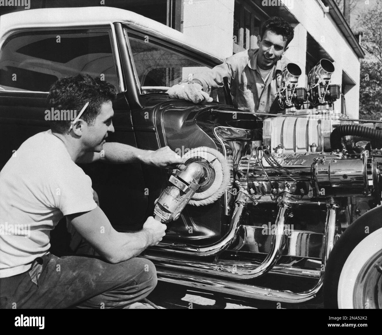 With special care, Mike and Larry Alexander apply a finish to Donald ...