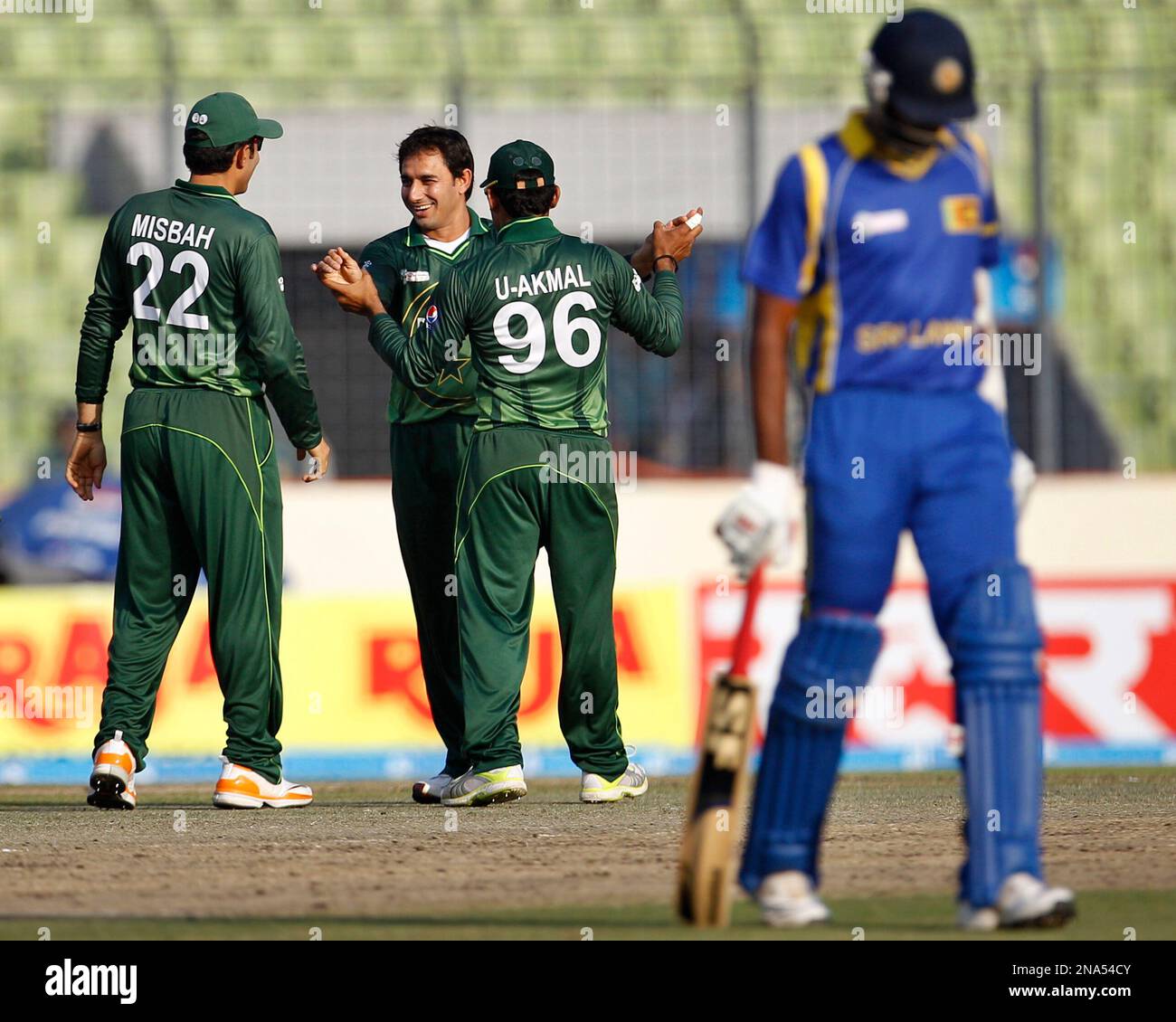 Pakistan's Saeed Ajmal, second left, celebrates with teammates the ...