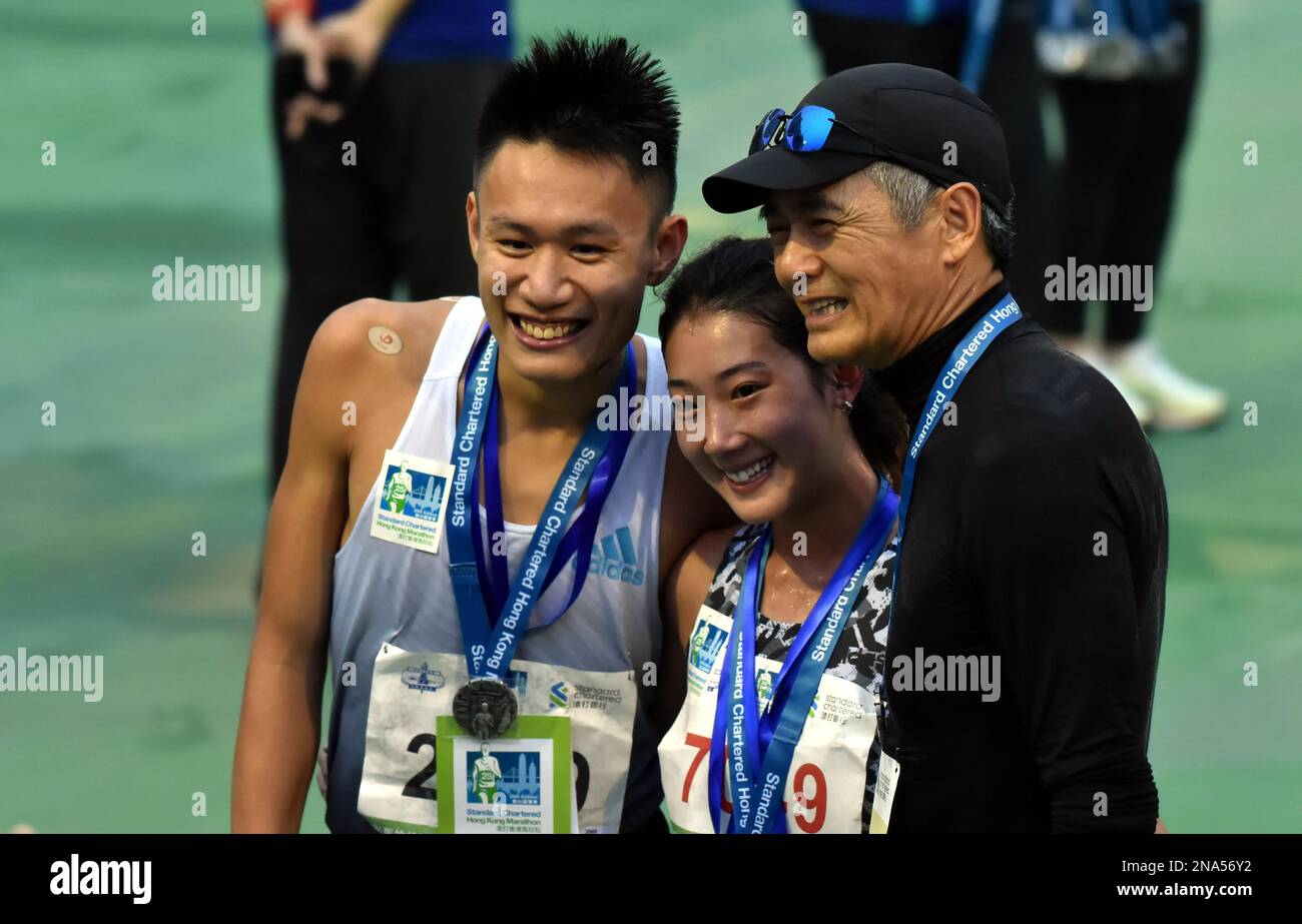 Hong Kong actor Chow Yun-fat poses with fans after he challenged the marathon for the first time ...