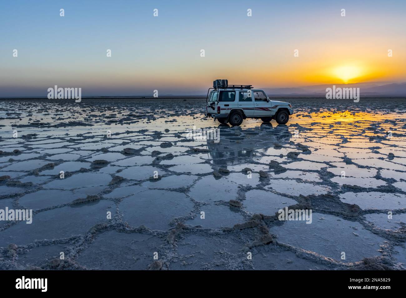 Four-wheel drive vehicles on the salt flats of Lake Karum (Lake Assale ...