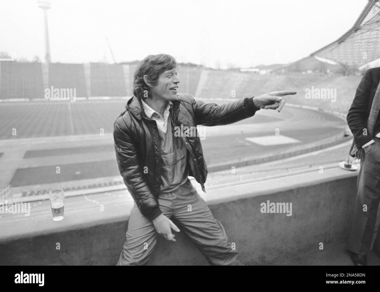 Mick Jagger from The Rolling Stones points and smiles during a visit to ...