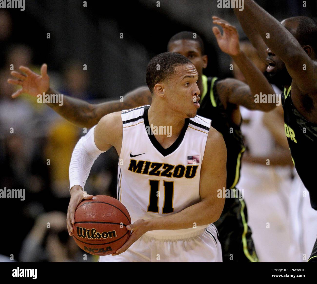 Missouri Tigers guard Michael Dixon (11) is pressured by Baylor players ...
