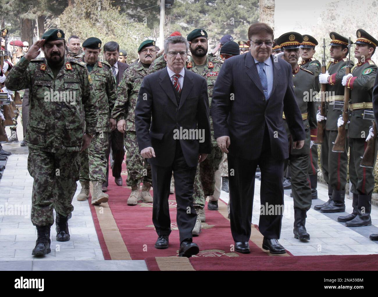 Afghan Defense Minister Abdul Rahim Wardak, right, walks with his ...
