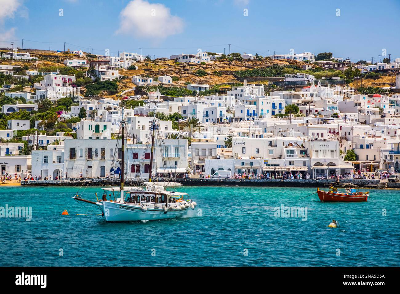 Coast of Greek island on the Mediterranean with boats near the ...