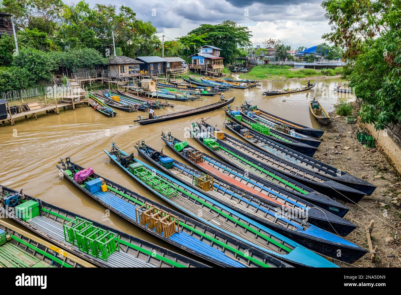 Long boats along the river; Yawngshwe, Shan State, Myanmar Stock Photo ...