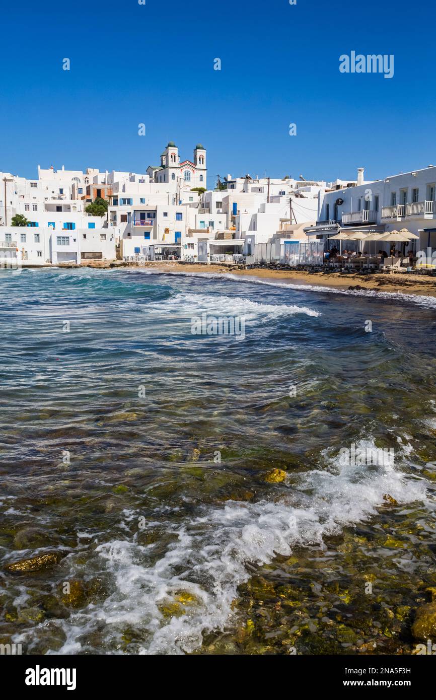 Waterfront of Naoussa with beach, restaurant patio and traditional ...