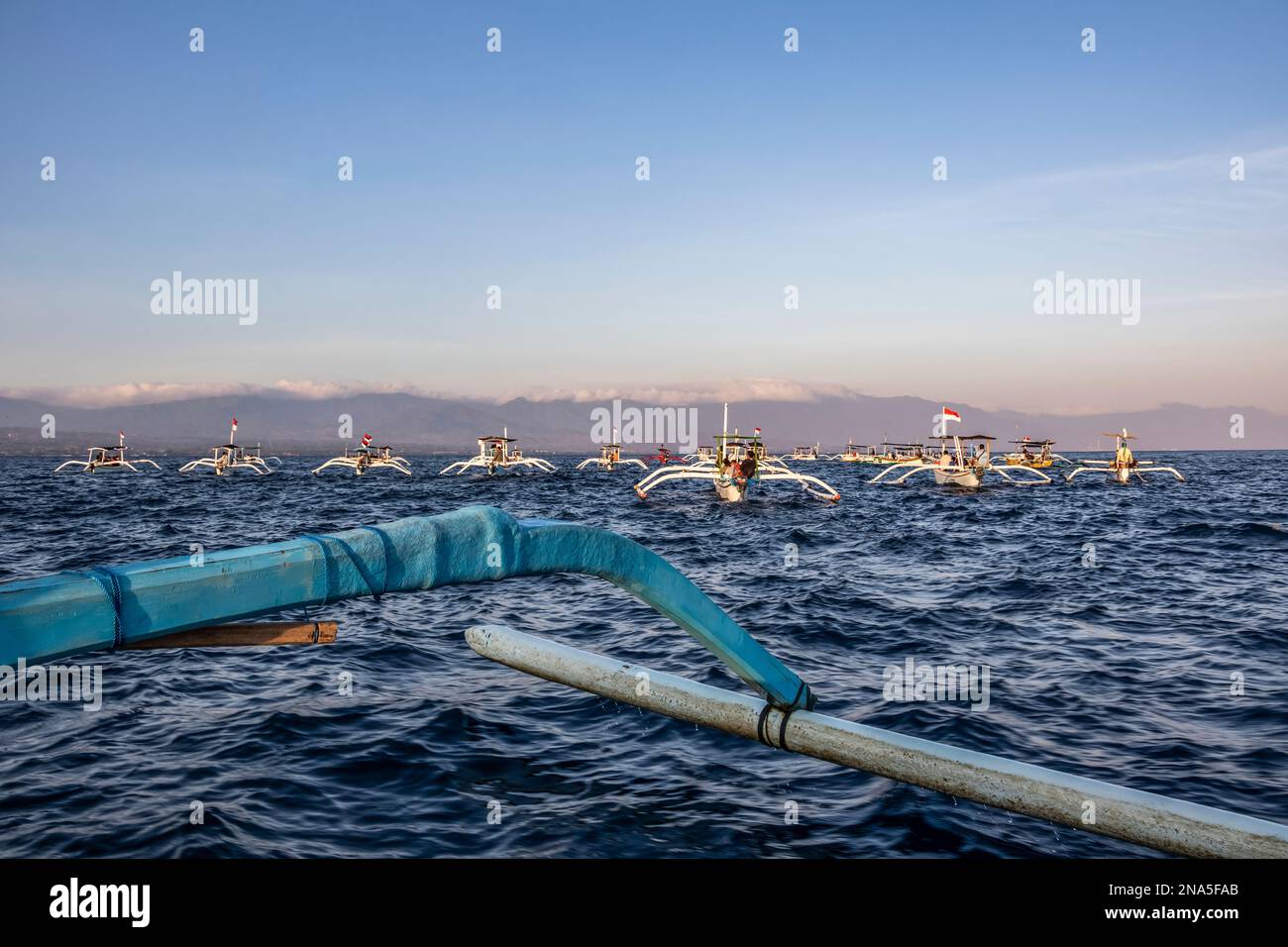 Indonesian jukung, traditional wooden outrigger canoes; Lovina, Bali ...
