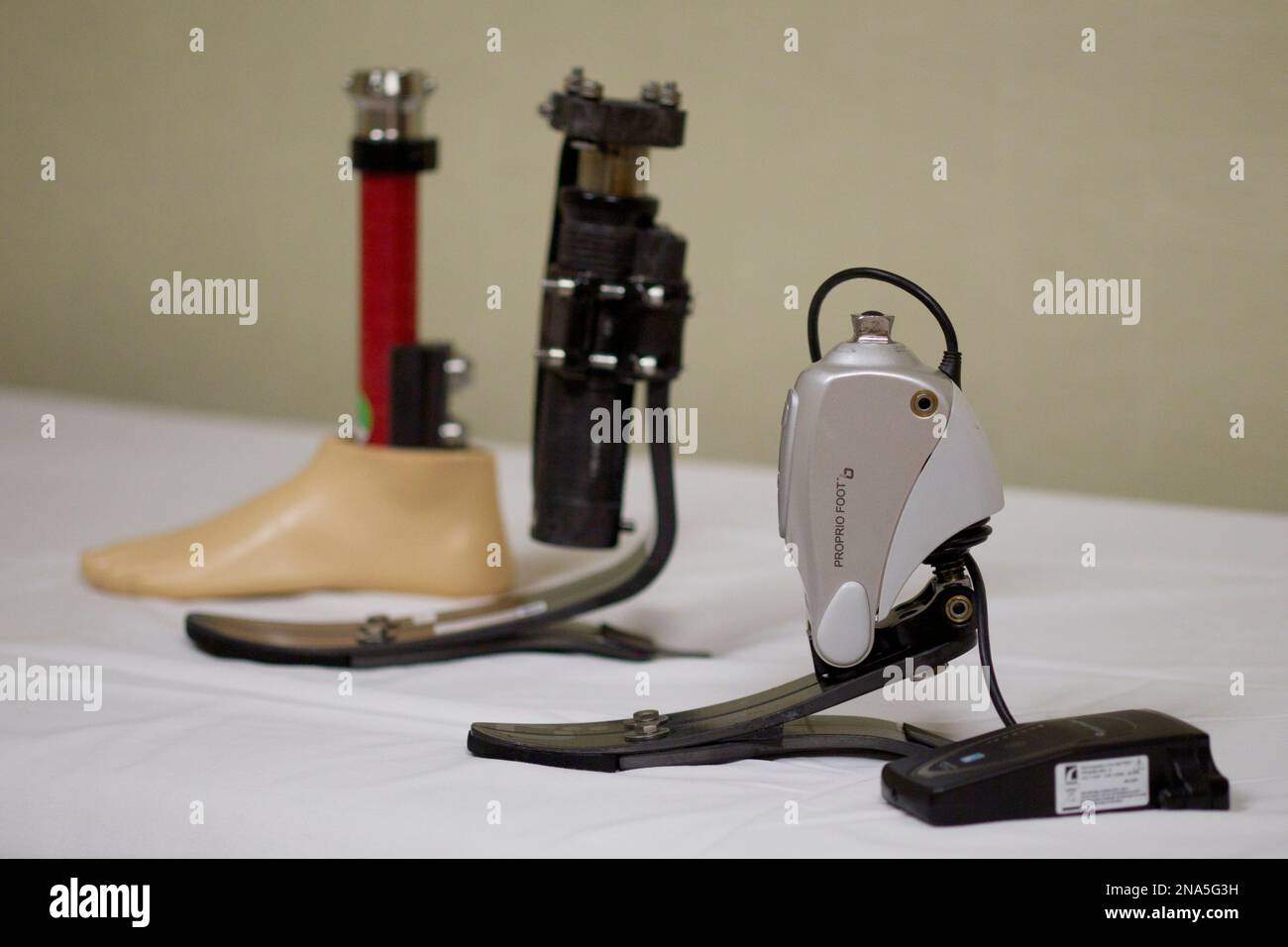 From right, the microprocessor controlled ankle/foot prosthetic, shock ...