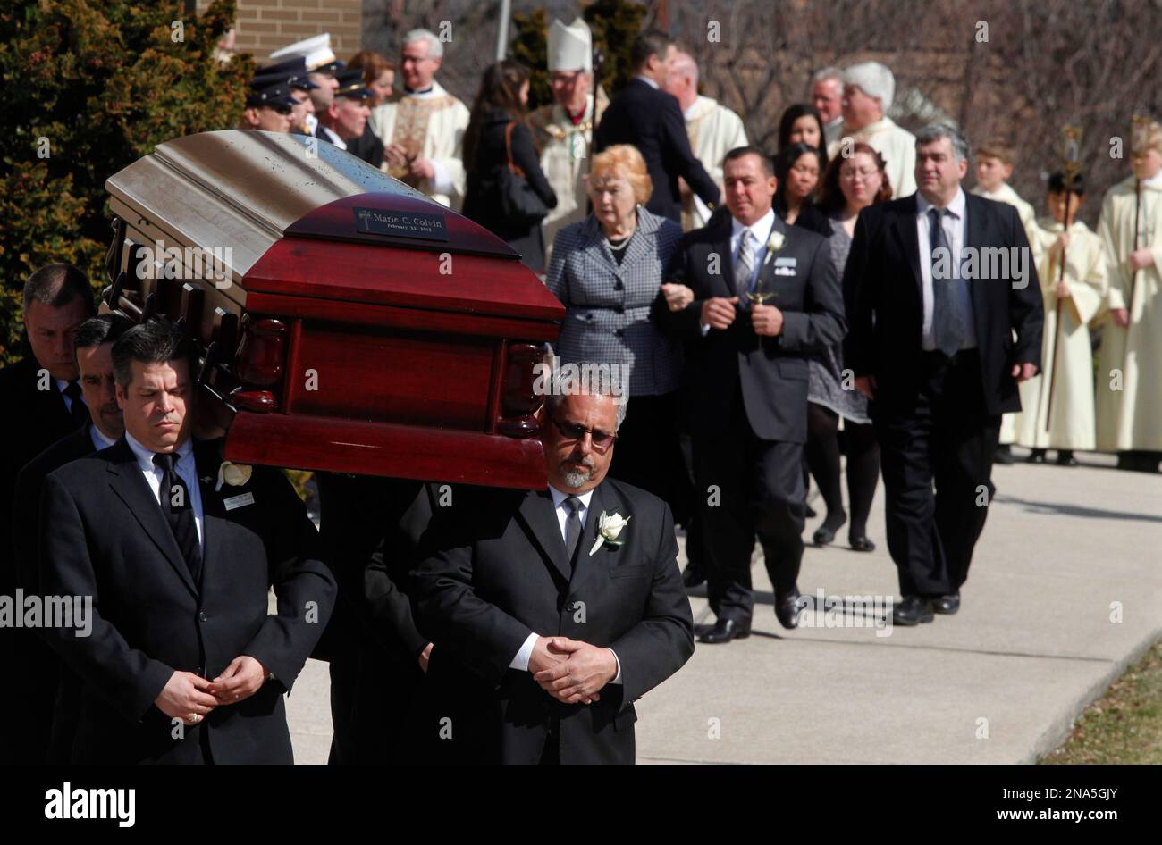 Pallbearers carry Marie Colvin's casket following funeral services for ...