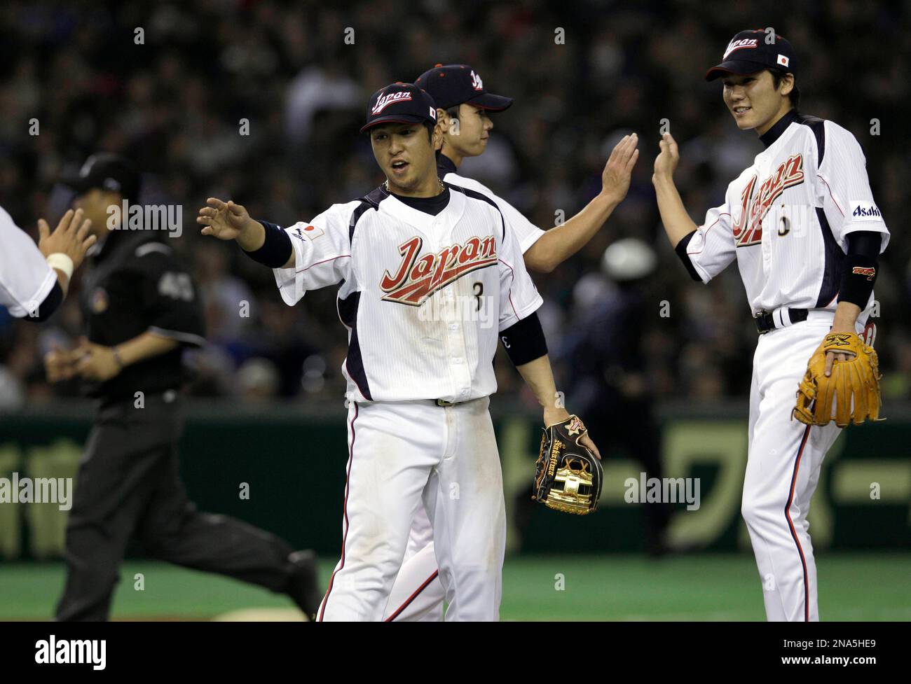 Japan's third baseman Hiroyuki Nakajima (3) and shortstop Hayato ...