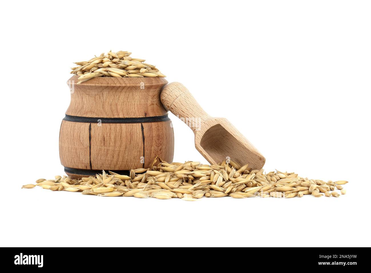Heap of organic oat grains with hulls or husks in small wooden barrel ...