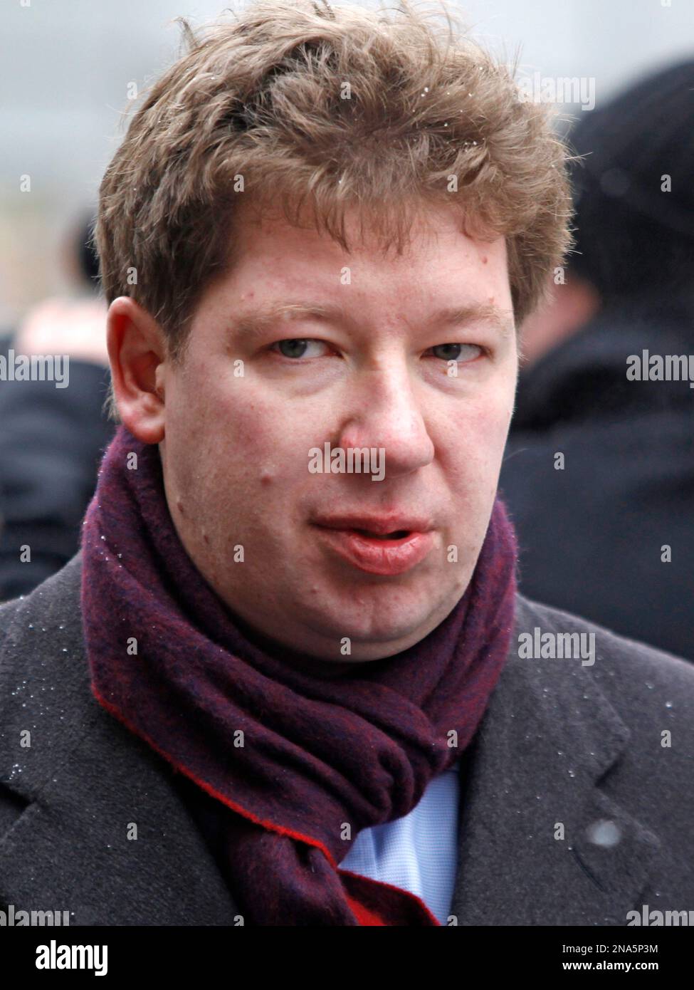 Russian businessman Alexei Kozlov speaks with journalists outside the ...