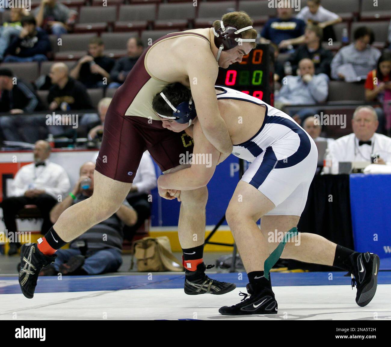 Mifflinburg's Nazar Mironenko, right, struggles with Chartiers-Houston ...
