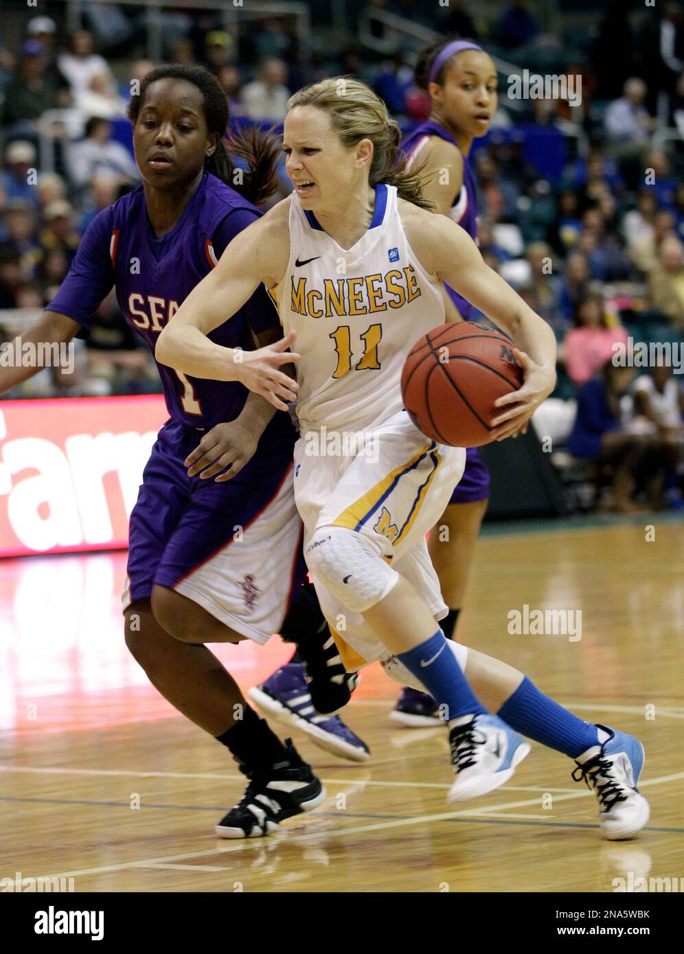 McNeese State's Caitlyn Baggett (11) drives past Stephen F. Austin's ...
