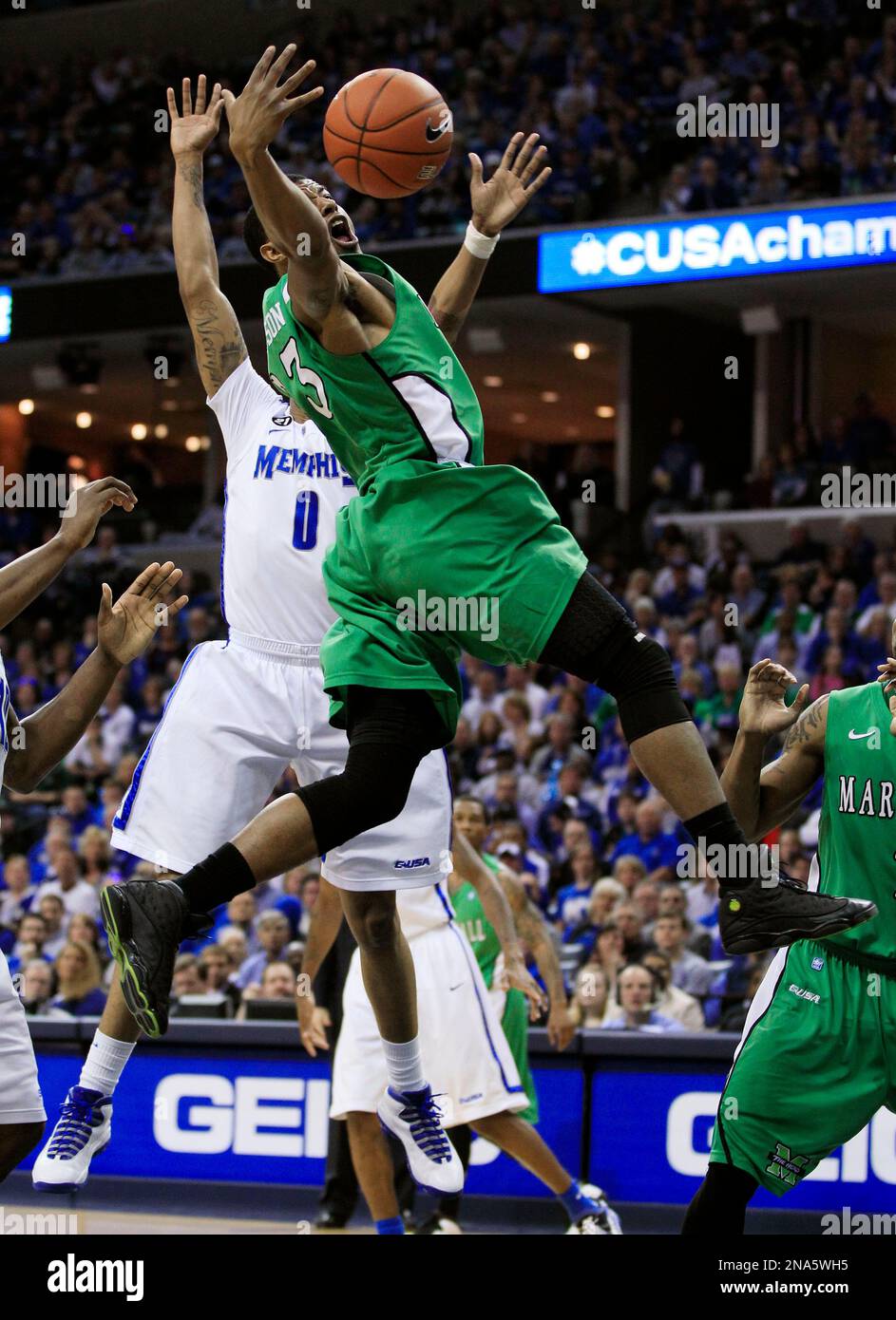 Marshall guard Shaquille Johnson (23 )loses the ball as he drives ...