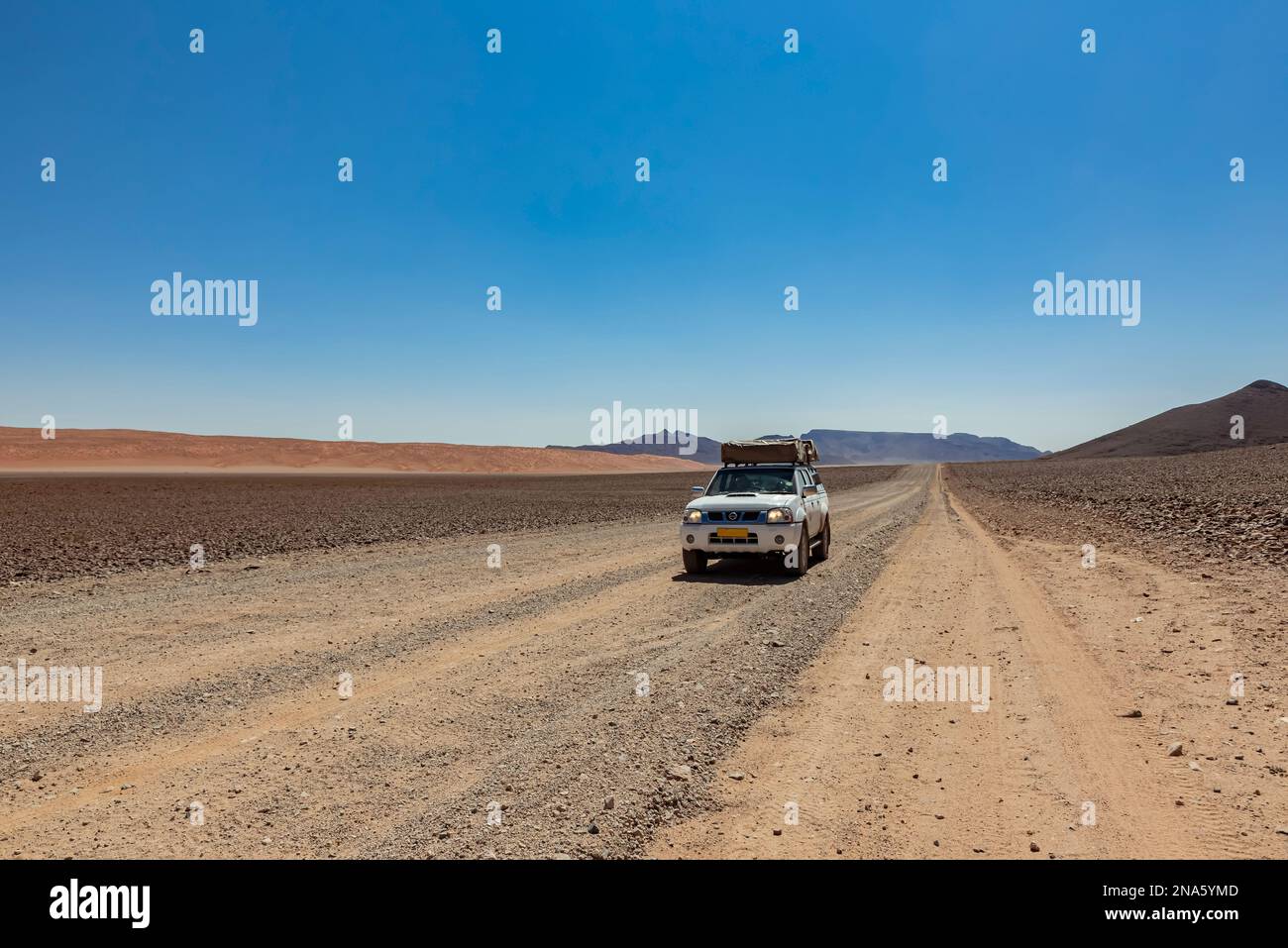 Driving on a long, dry road, Namib Desert; Namibia Stock Photo - Alamy