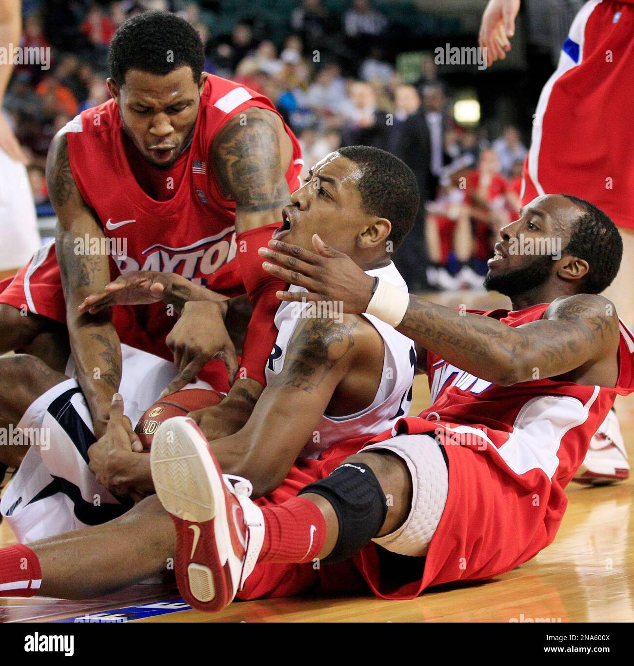 Dayton's Chris Johnson, left, and Kevin Dillard, right, battle for the ...