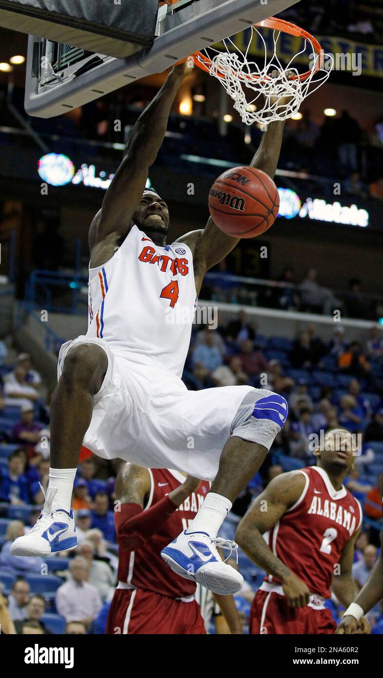 Florida's Patric Young (4) dunks the ball as Alabama guard Charles ...