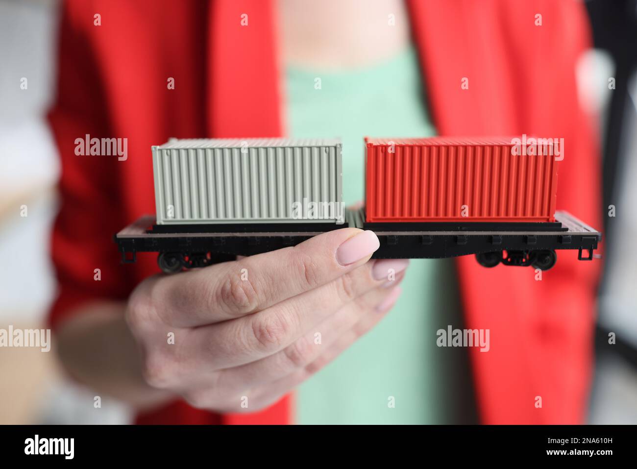 Logistics company manager holding railroad carts with freight ...