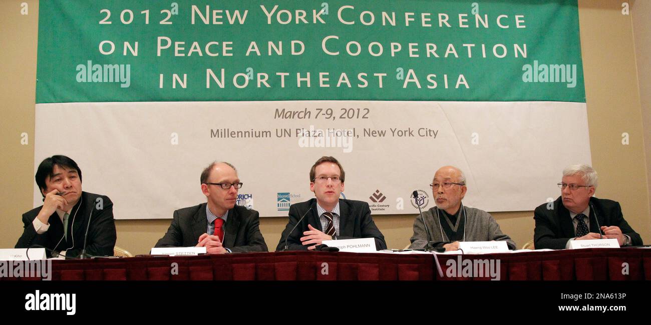 Yi Kiho, left, professor of political science and director of the ...