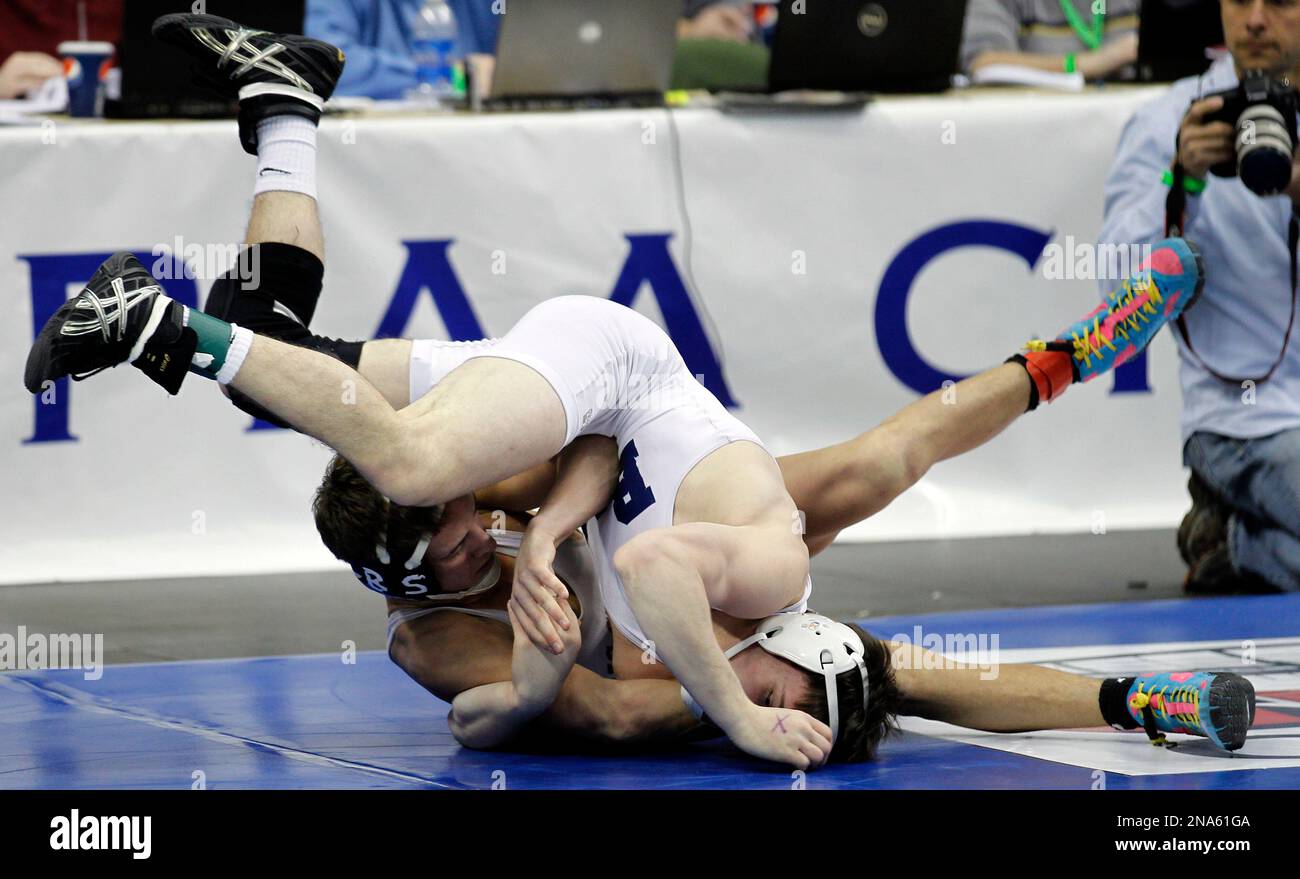 Blue Mountain's Corey Keener, head at right, struggles with Big Spring ...