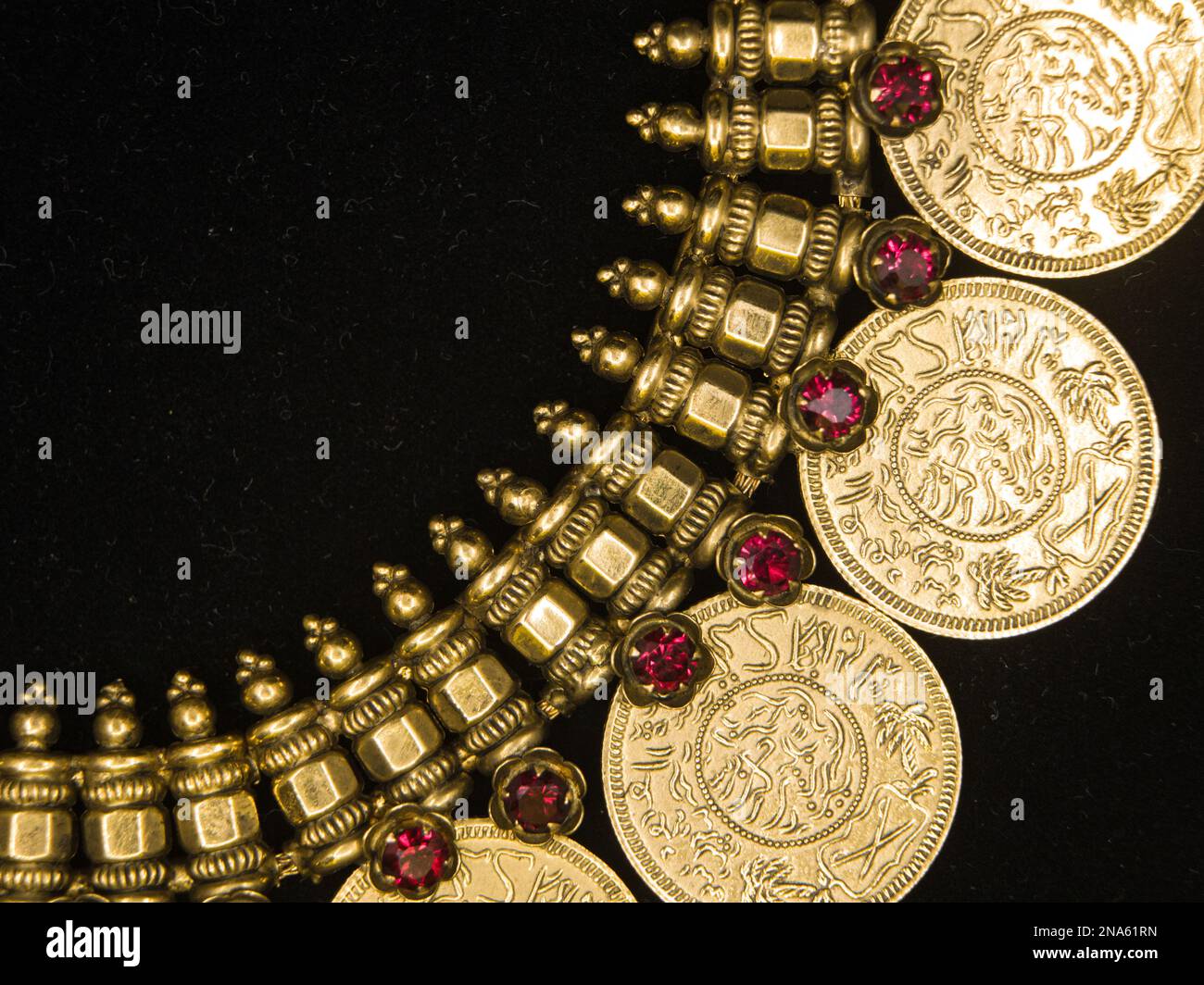 a vintage gold necklace with ornate design and detailed carvings which ...