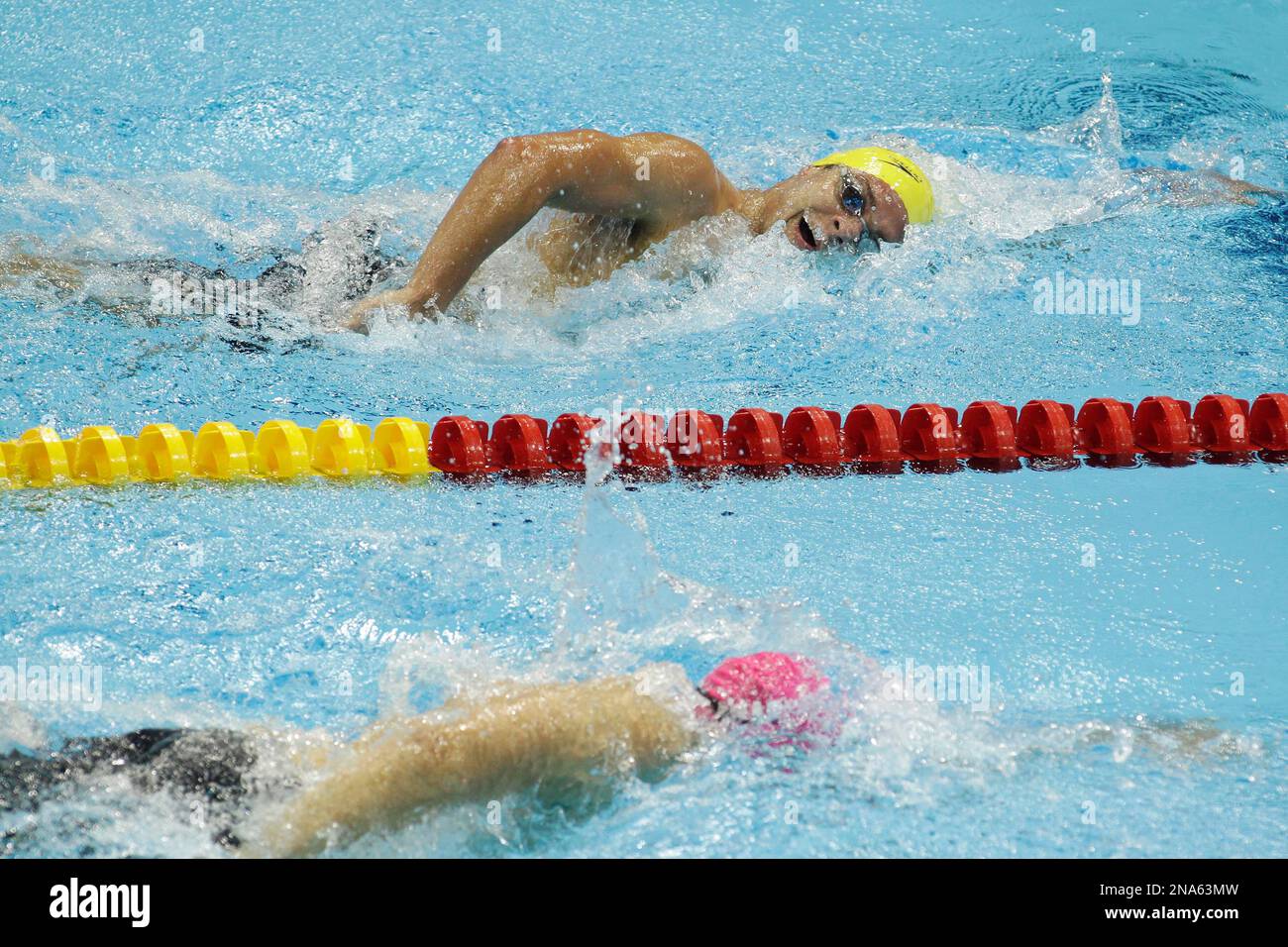 South Africa's Heerden Herman, top, competes in a heat of the men's ...