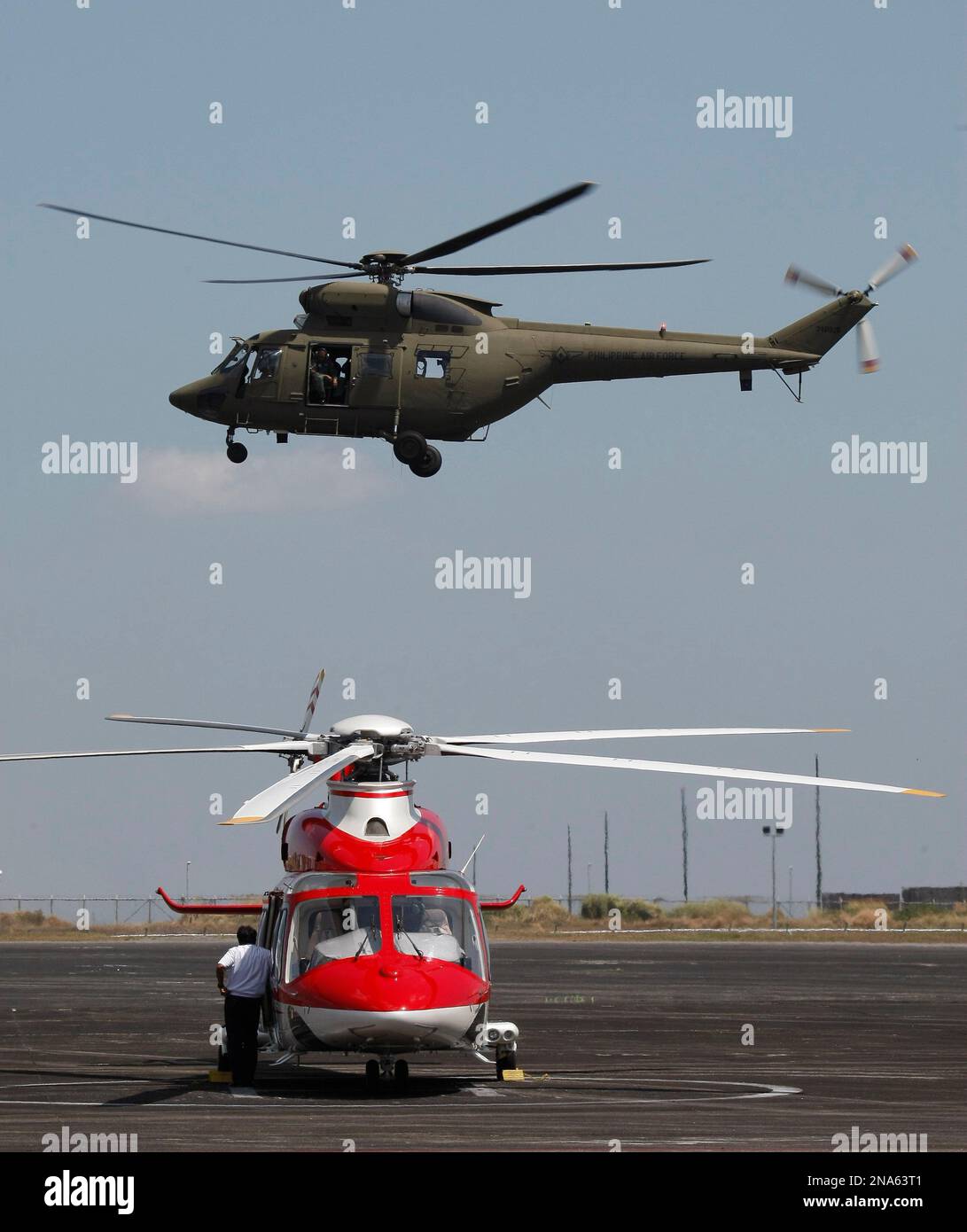 A brand new Polish multi-role Sokol Combat Utility helicopter takes off with some members of the ...