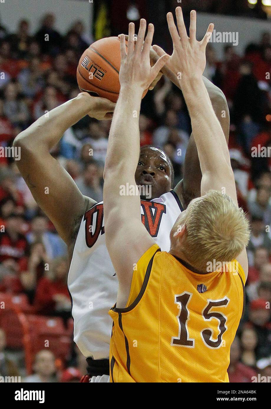 UNLV's Quintrell Thomas shoots against Wyoming's Adam Waddell in the ...